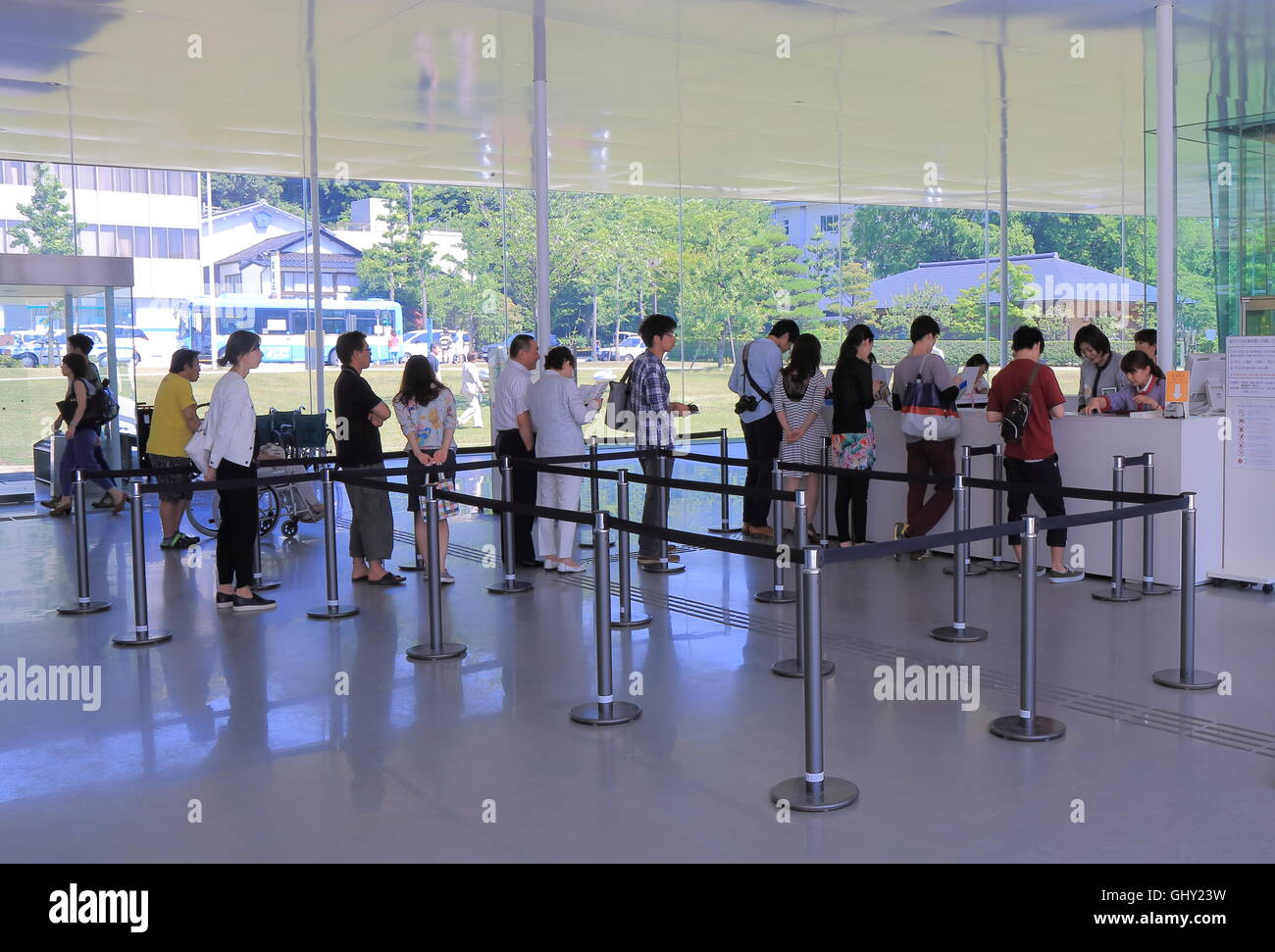 People queue to buy tickets at 21st Century Museum in Kanazawa Japan ...