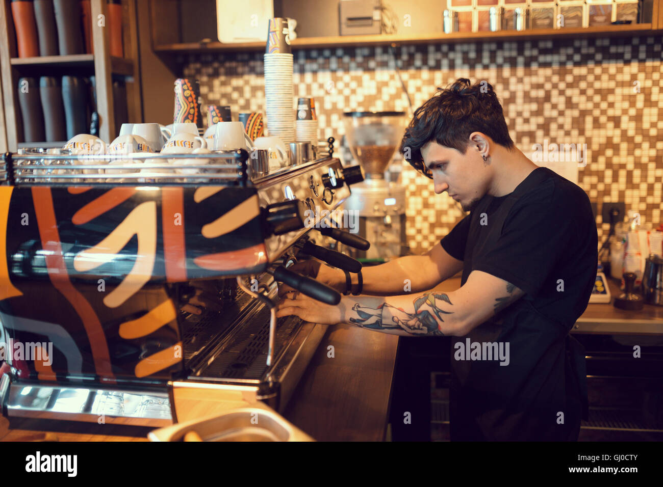 Barista at work in a coffee shop Stock Photo - Alamy