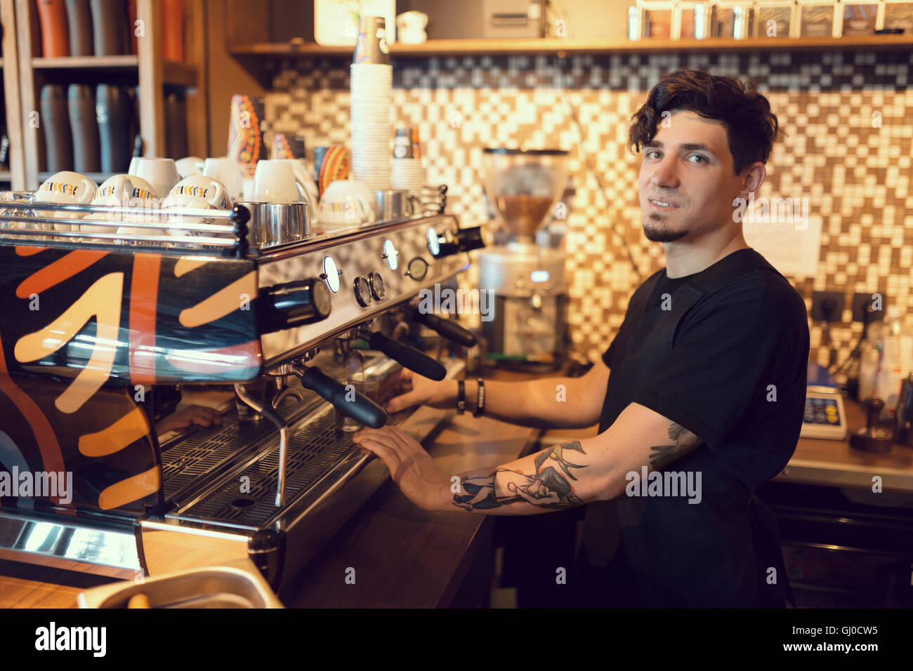 Barista at work in a coffee shop Stock Photo - Alamy