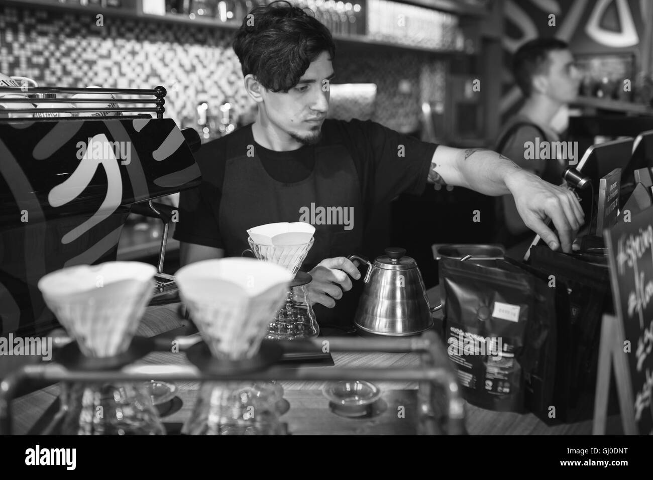 Barista at work in a coffee shop Stock Photo - Alamy