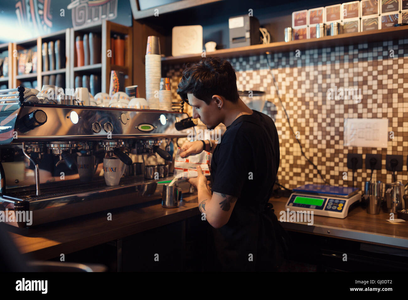 Barista at work in a coffee shop Stock Photo - Alamy