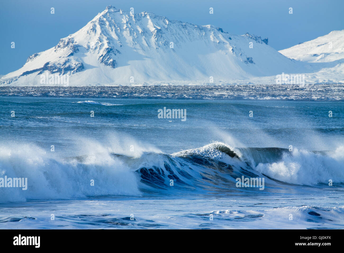 waves breaking at Budavik beneath the Snaefellsjokull, Iceland Stock ...