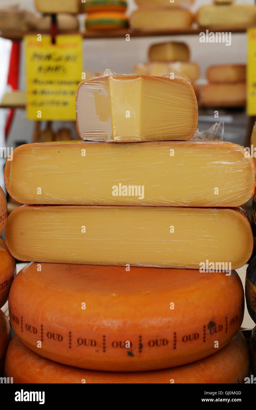 Dutch cheeses on display at the colorful outdoor market in Rotterdam ...