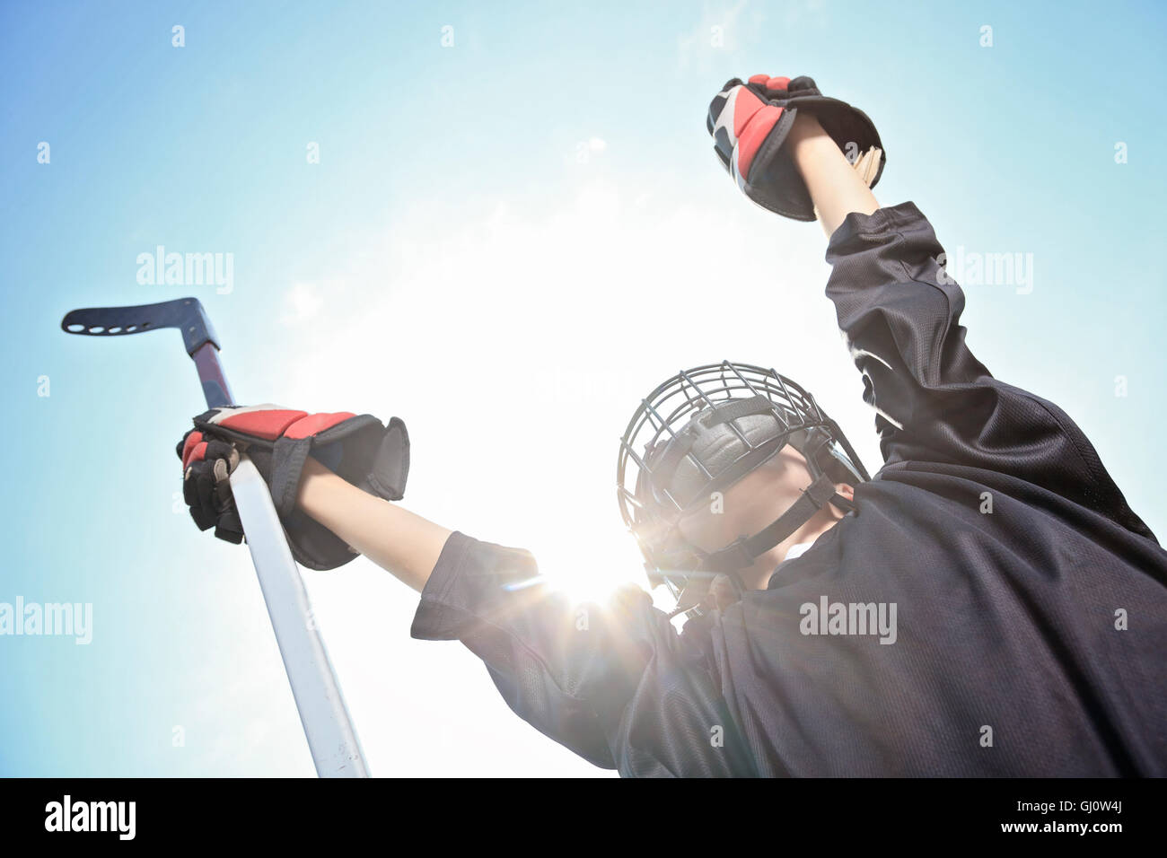 A Portrait of hockey ball player outside with equipment Stock Photo - Alamy