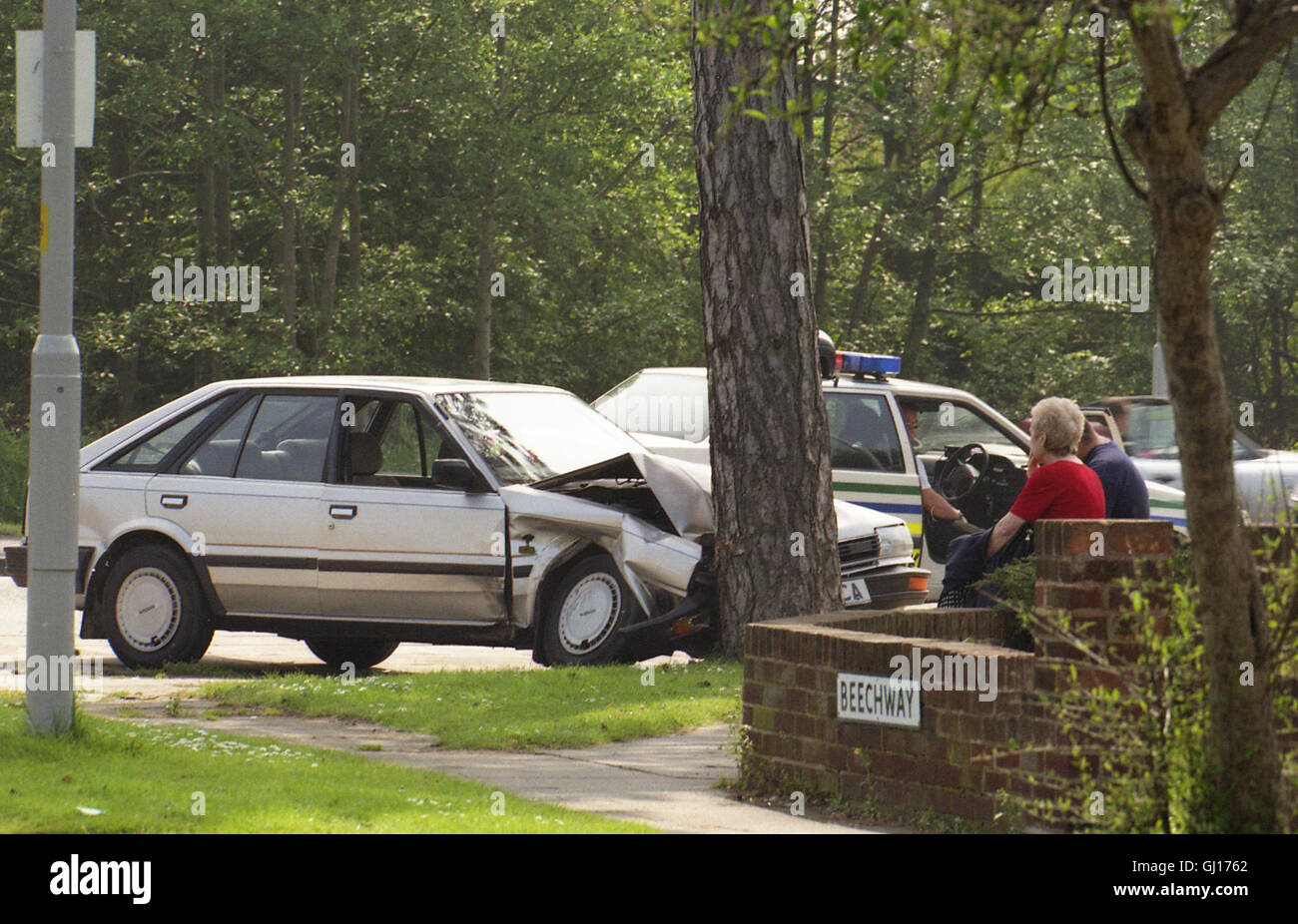 car crash as a car hits a tree. Everyonr was OK Stock Photo - Alamy