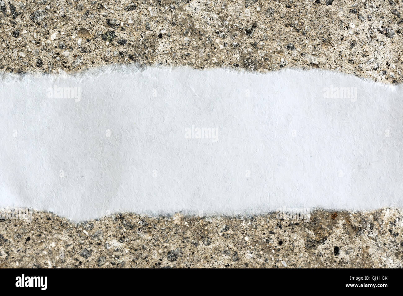 Ragged piece of paper on stone background Stock Photo - Alamy