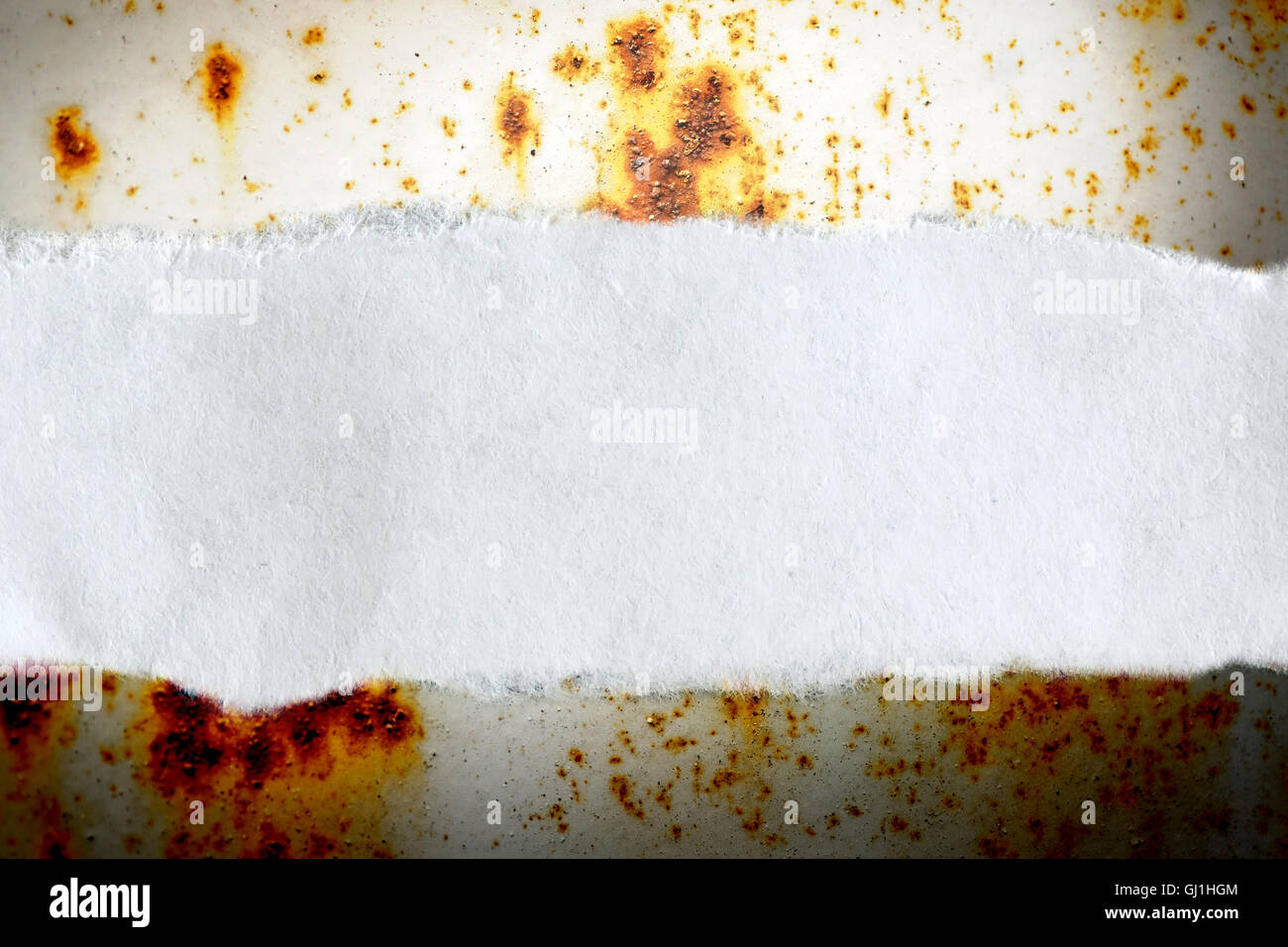 Ragged piece of paper on rusty background Stock Photo - Alamy