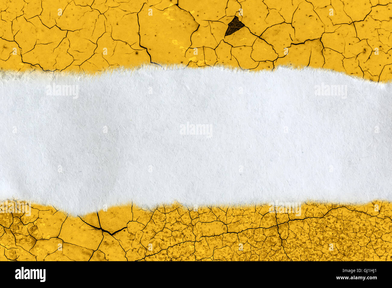 Ragged piece of paper on cracked yellow background Stock Photo - Alamy