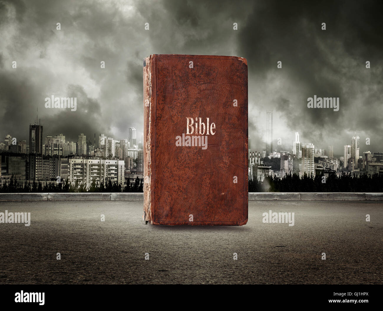 Bible on view of city in stormy sky background Stock Photo - Alamy