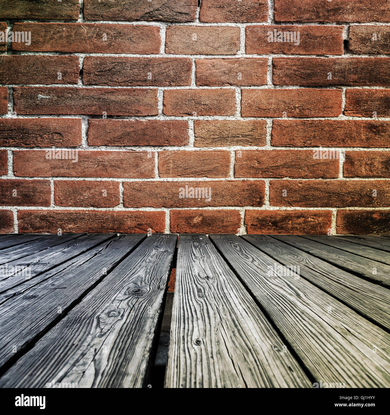 Rostrum made of wooden planks on brick wall background Stock Photo - Alamy