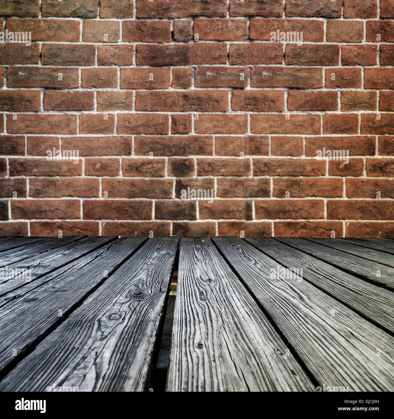 Rostrum made of wooden planks on brick wall background Stock Photo - Alamy