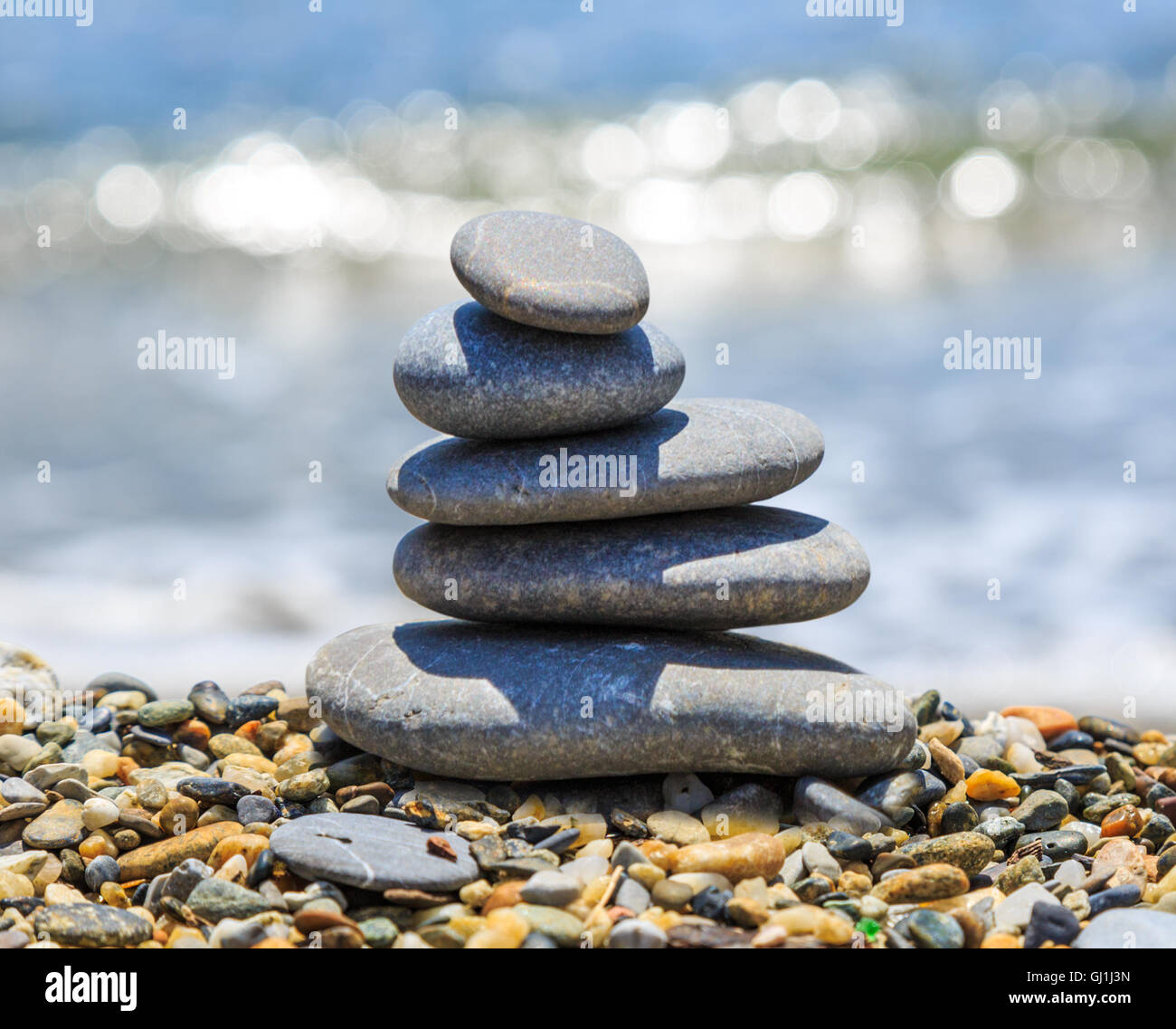 Seashore background with stone construction in closeup Stock Photo - Alamy