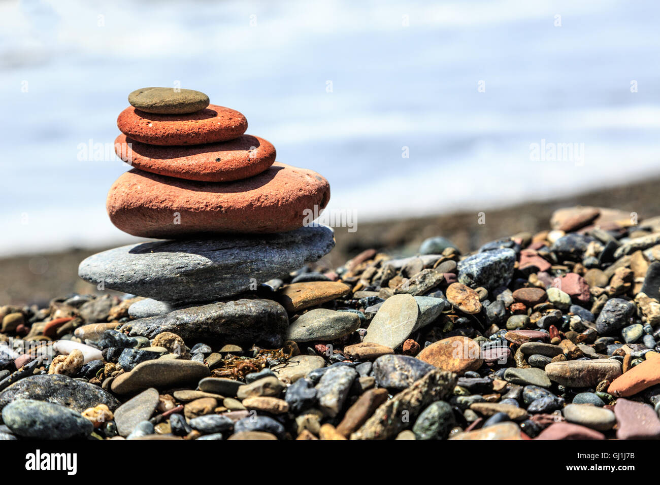 Seashore with stone construction as background in closeup Stock Photo ...