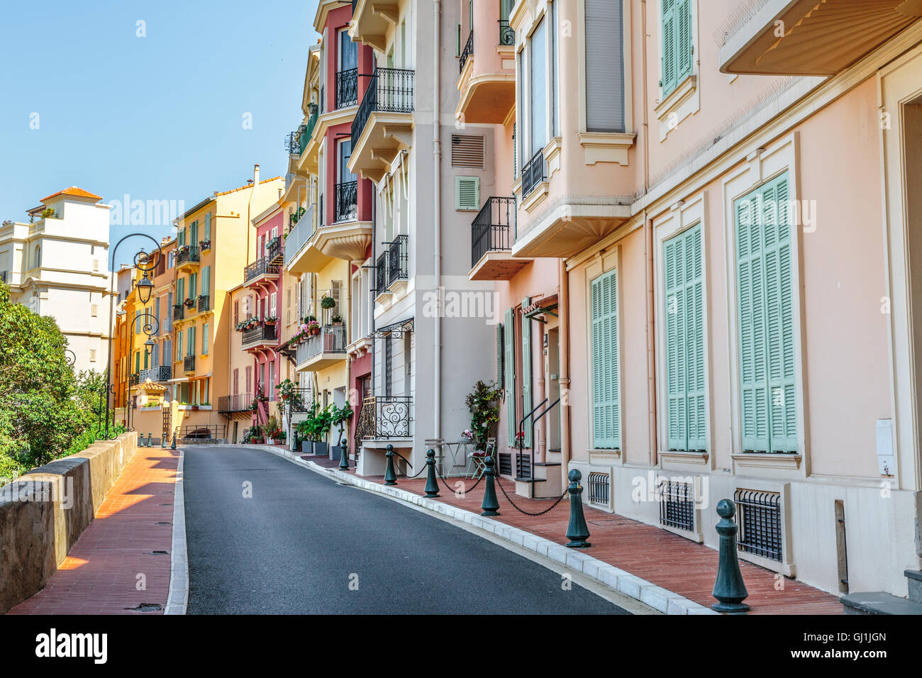 Sidewalk along apartments in Monaco sunny day Stock Photo - Alamy