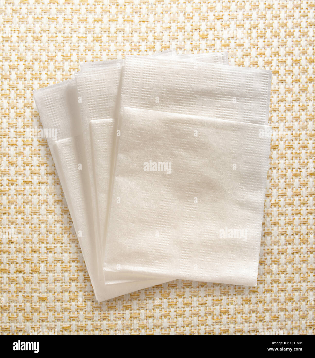 White paper napkins on the textile background Stock Photo - Alamy