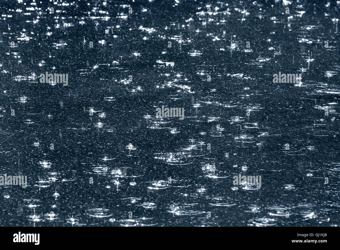 Water drops and splash in the puddles Stock Photo - Alamy