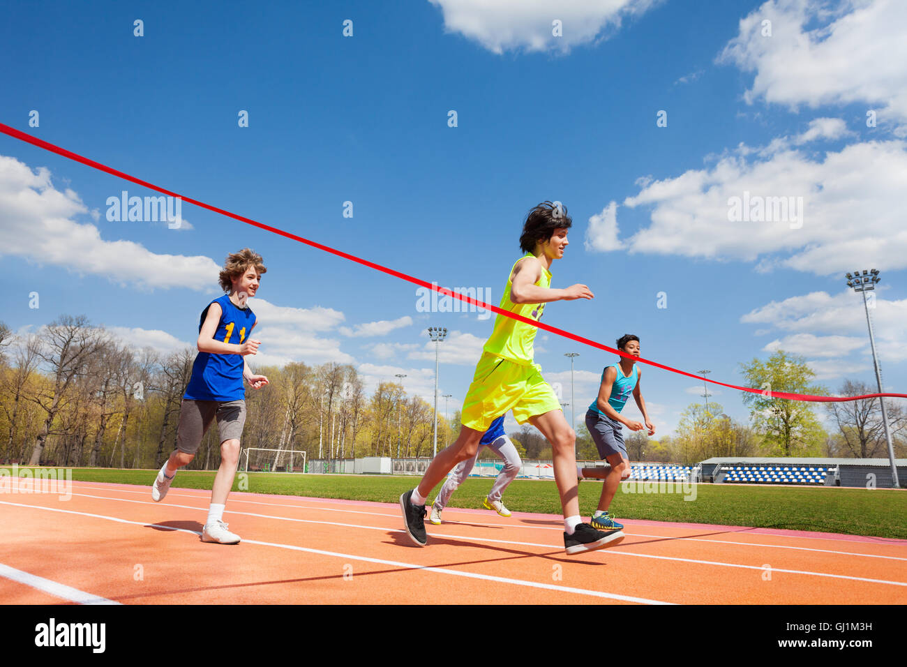 Male athlete crossing finish line hi-res stock photography and images ...