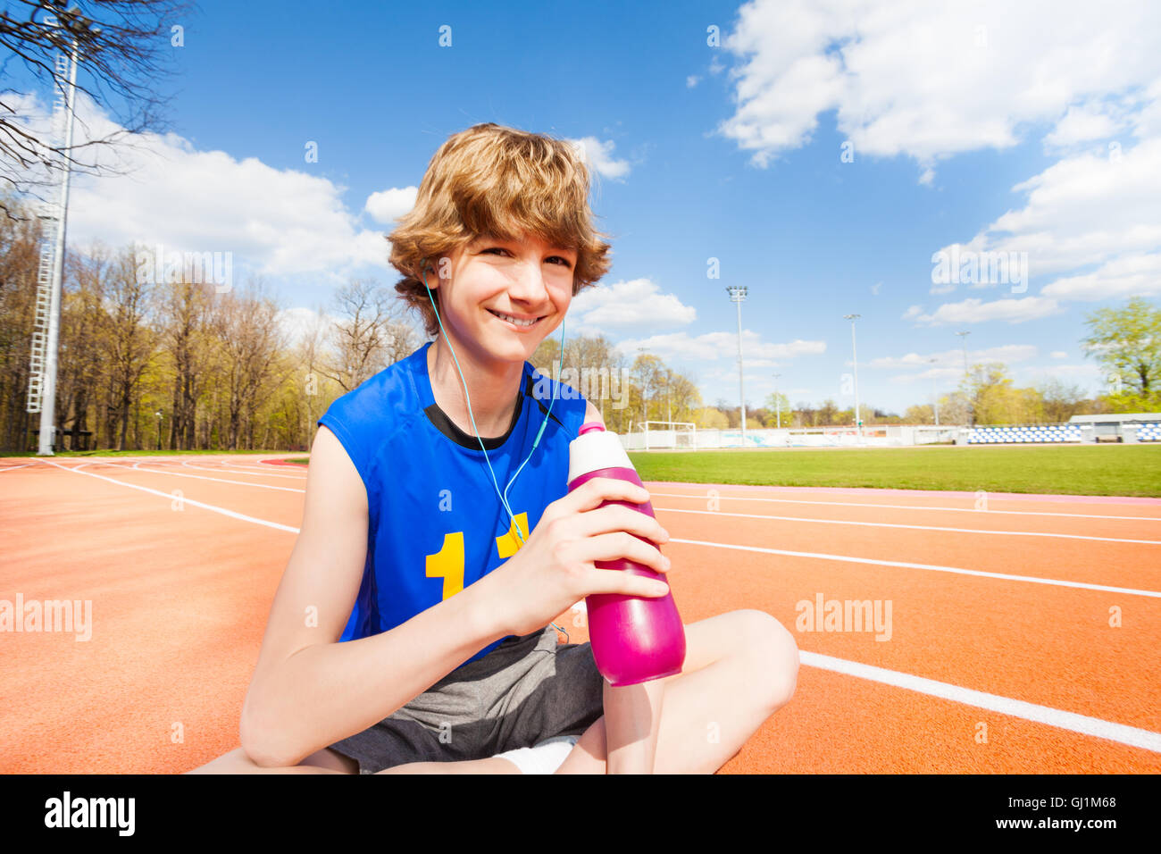 Happy boy having rest after gymnastic activity Stock Photo - Alamy