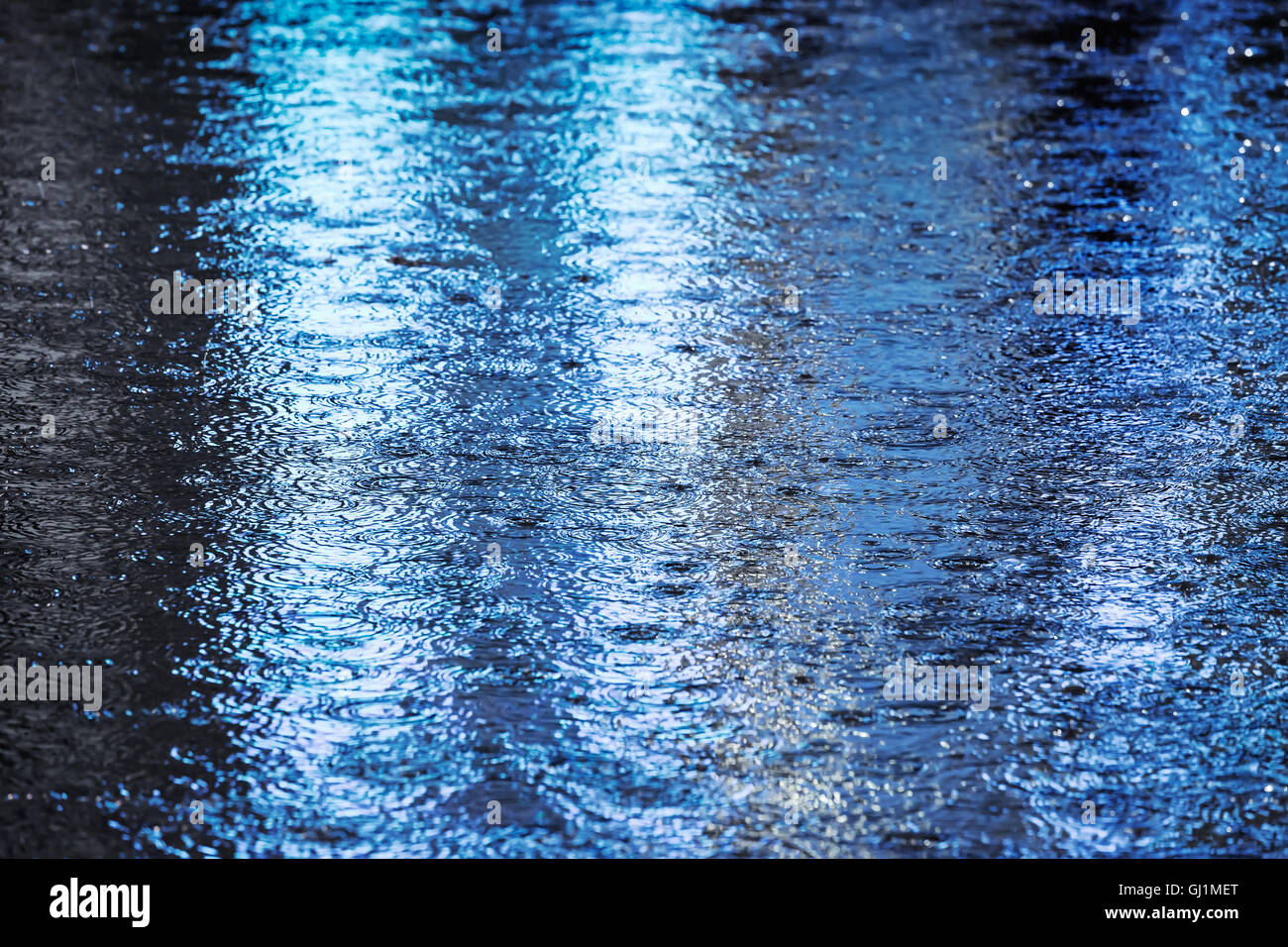 color reflection in the asphalt road during rain in the evening Stock ...