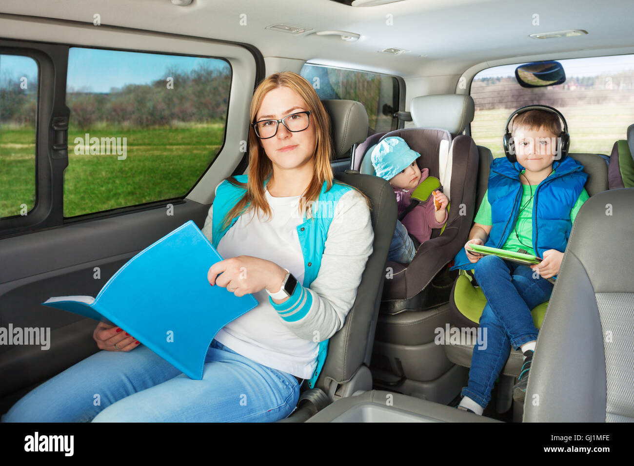 Portrait happy family inside car hi-res stock photography and images ...