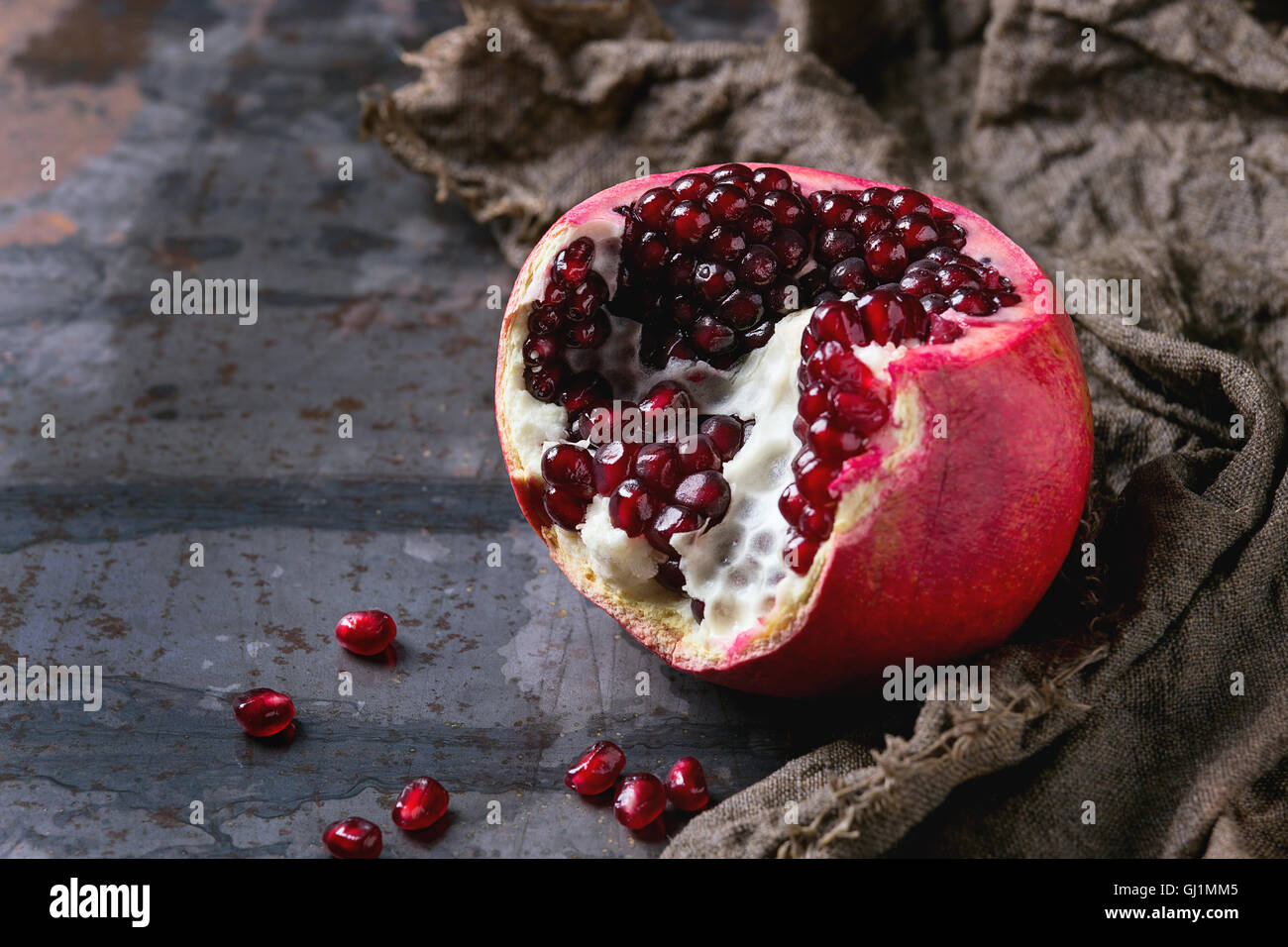 Sliced ripe pomegranate Stock Photo - Alamy
