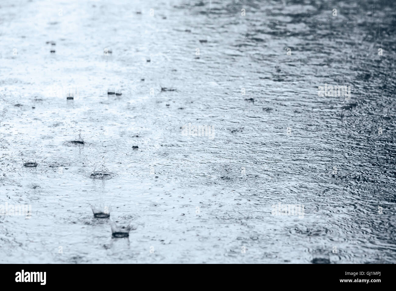 flooded road with water drops after heavy rain Stock Photo - Alamy