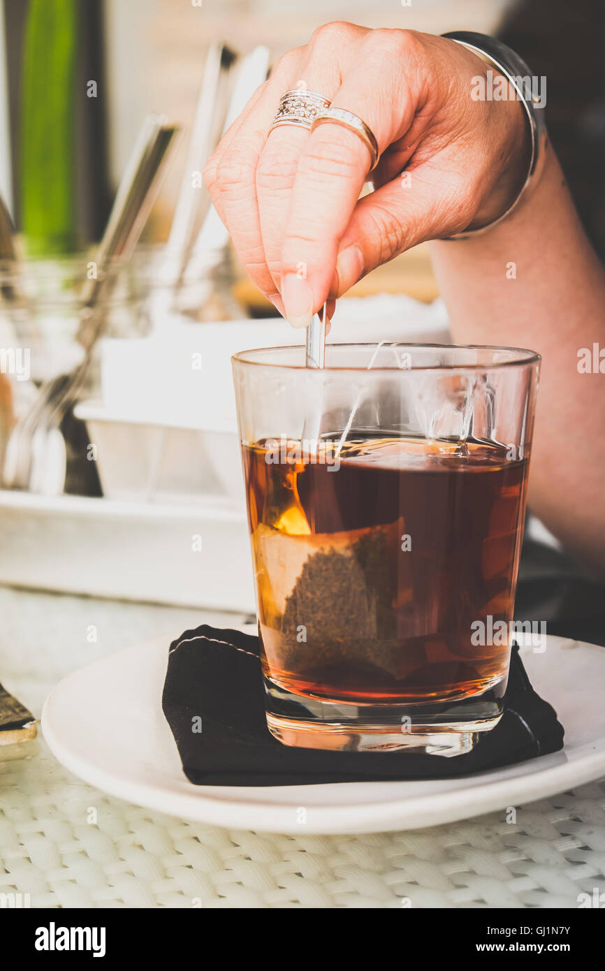 Hand with tea hi-res stock photography and images - Alamy