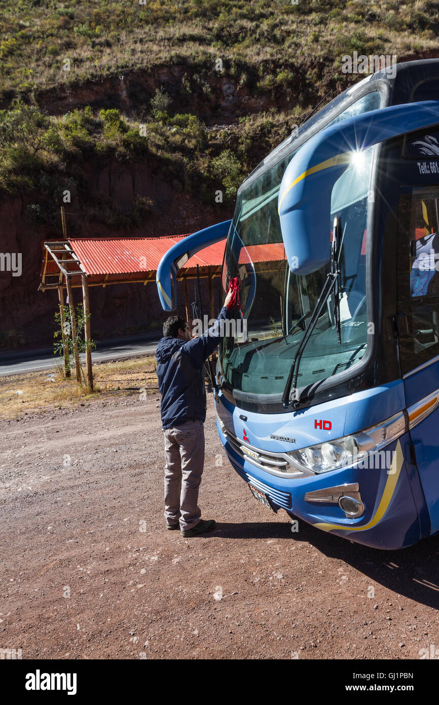 Cusco, Peru - May 15: Professional bus driver cleaning the windshield ...