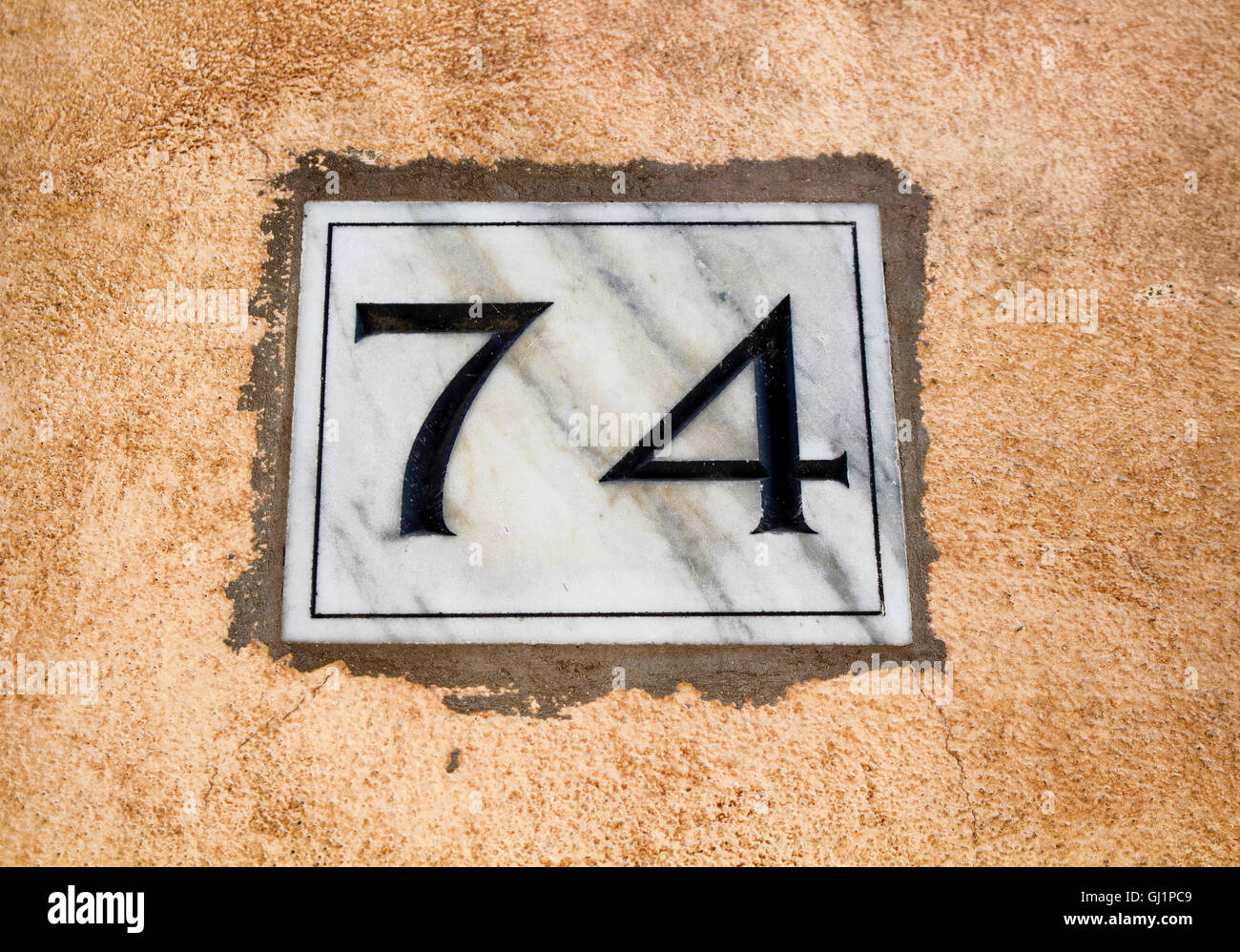Engraved building number in Rome Stock Photo - Alamy