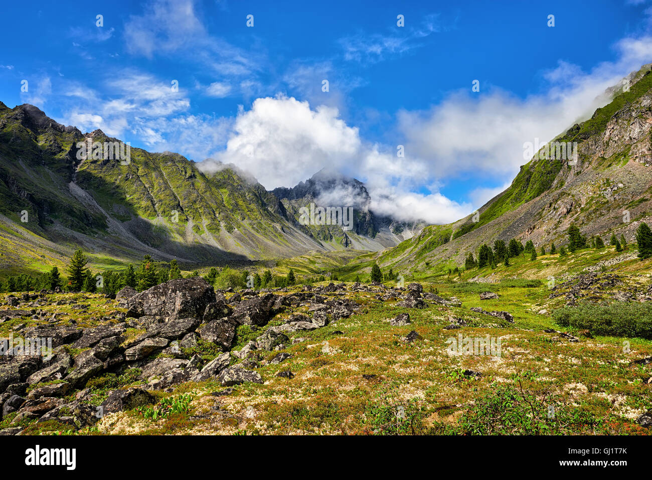 Mountain valley and peak in clouds . Eastern Sayan . Russia Stock Photo ...