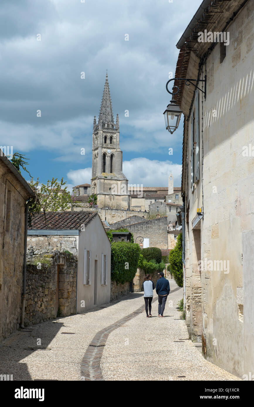 A couple walking down street in Saint Émilion, Gironde, France Stock ...