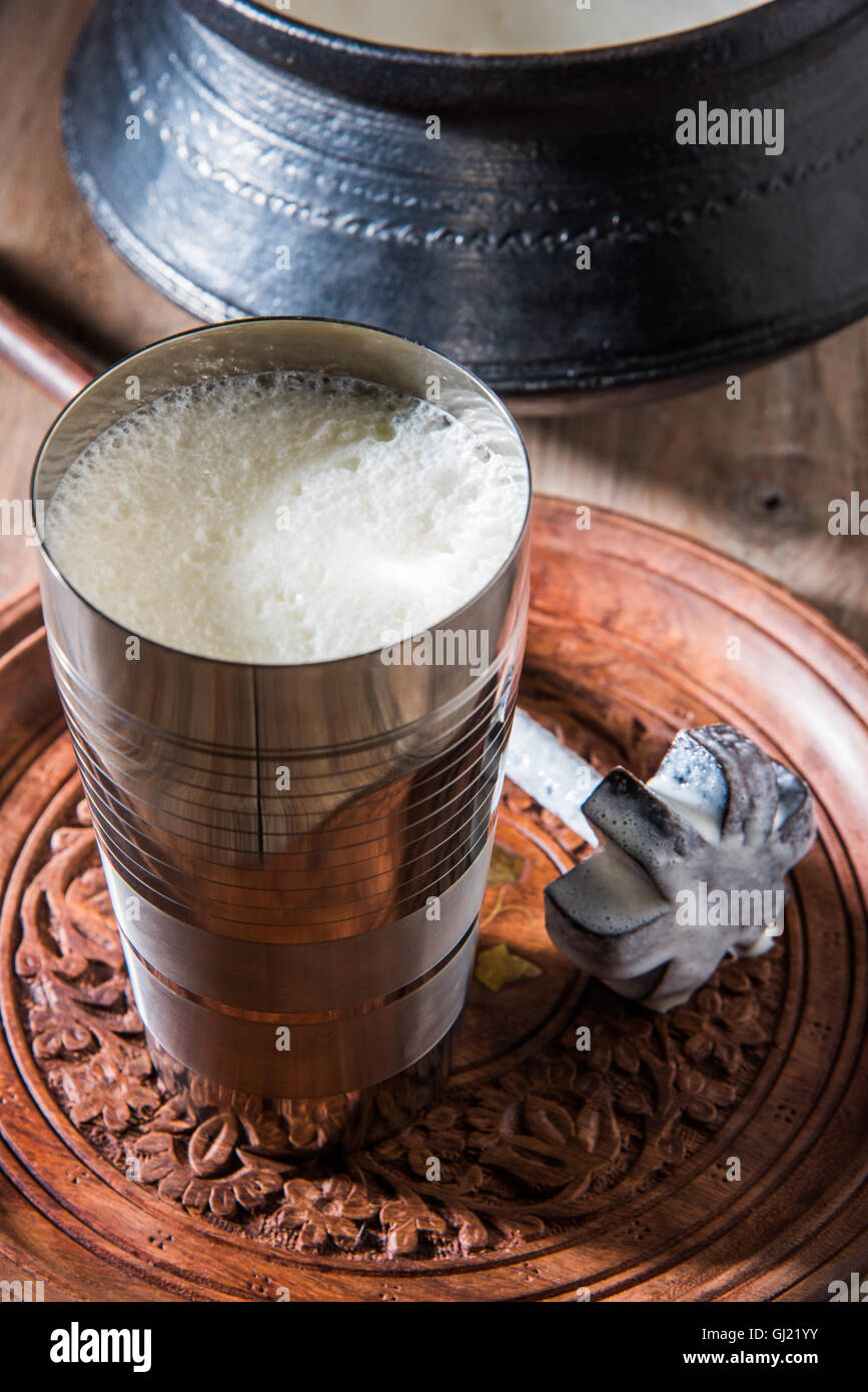 Indian sweet Lassi made up of milk, curd, sugar and salt mixed with ice ...