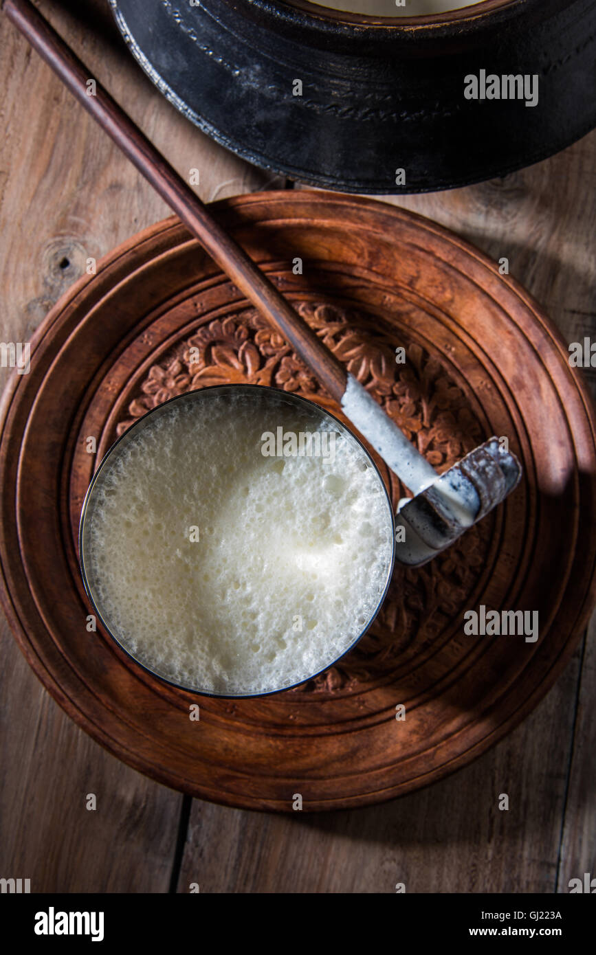 Indian sweet Lassi made up of milk, curd, sugar and salt mixed with ice ...