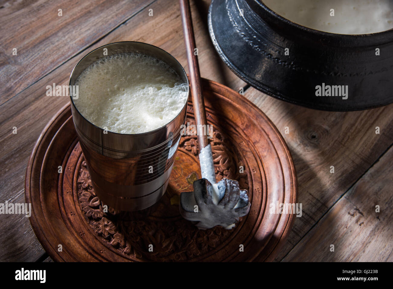 Indian sweet Lassi made up of milk, curd, sugar and salt mixed with ice ...