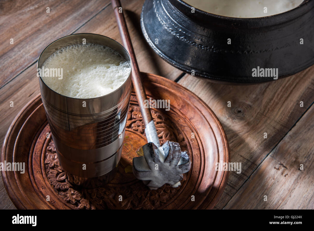 Indian sweet Lassi made up of milk, curd, sugar and salt mixed with ice ...
