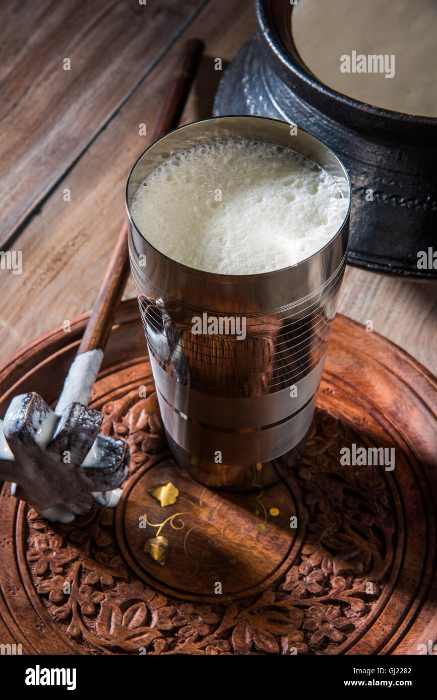 Indian sweet Lassi made up of milk, curd, sugar and salt mixed with ice ...
