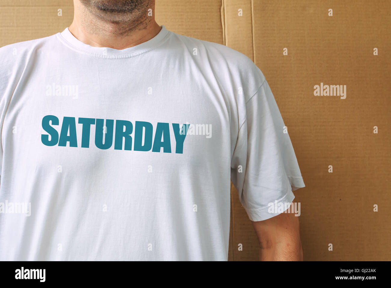Days of the week - saturday, man wearing white t-shirt with name of the ...