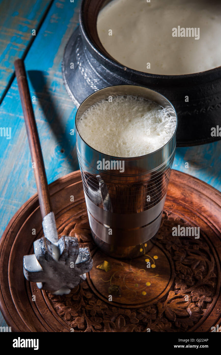 Indian sweet Lassi made up of milk, curd, sugar and salt mixed with ice ...