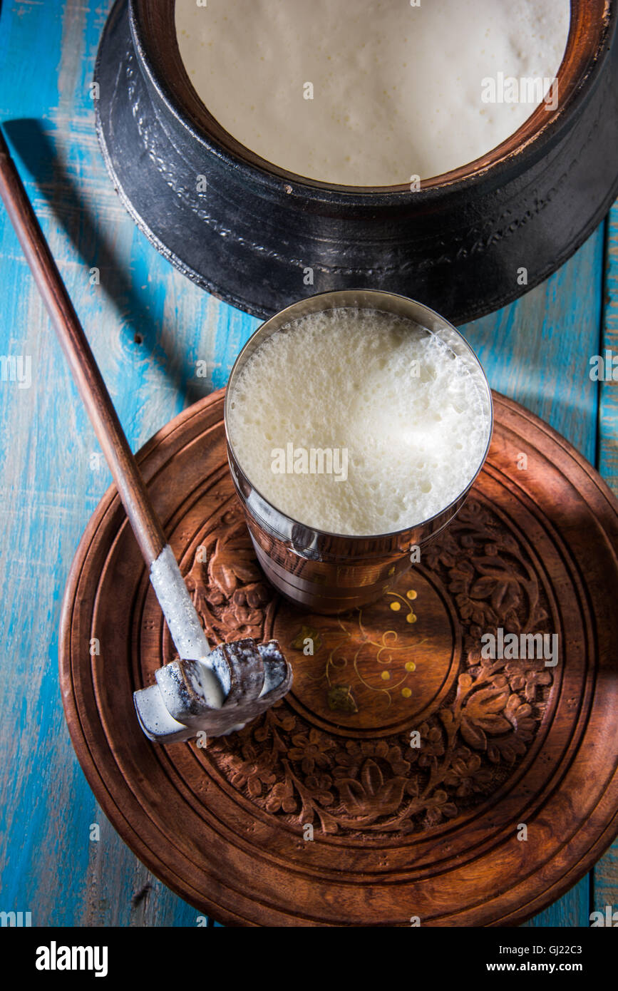 Indian sweet Lassi made up of milk, curd, sugar and salt mixed with ice ...