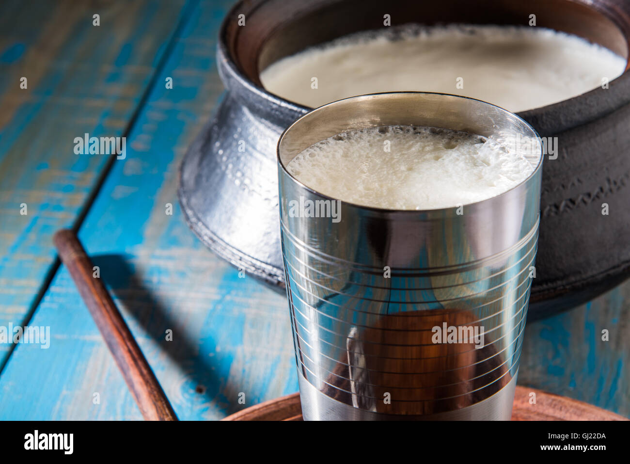 Indian sweet Lassi made up of milk, curd, sugar and salt mixed with ice ...