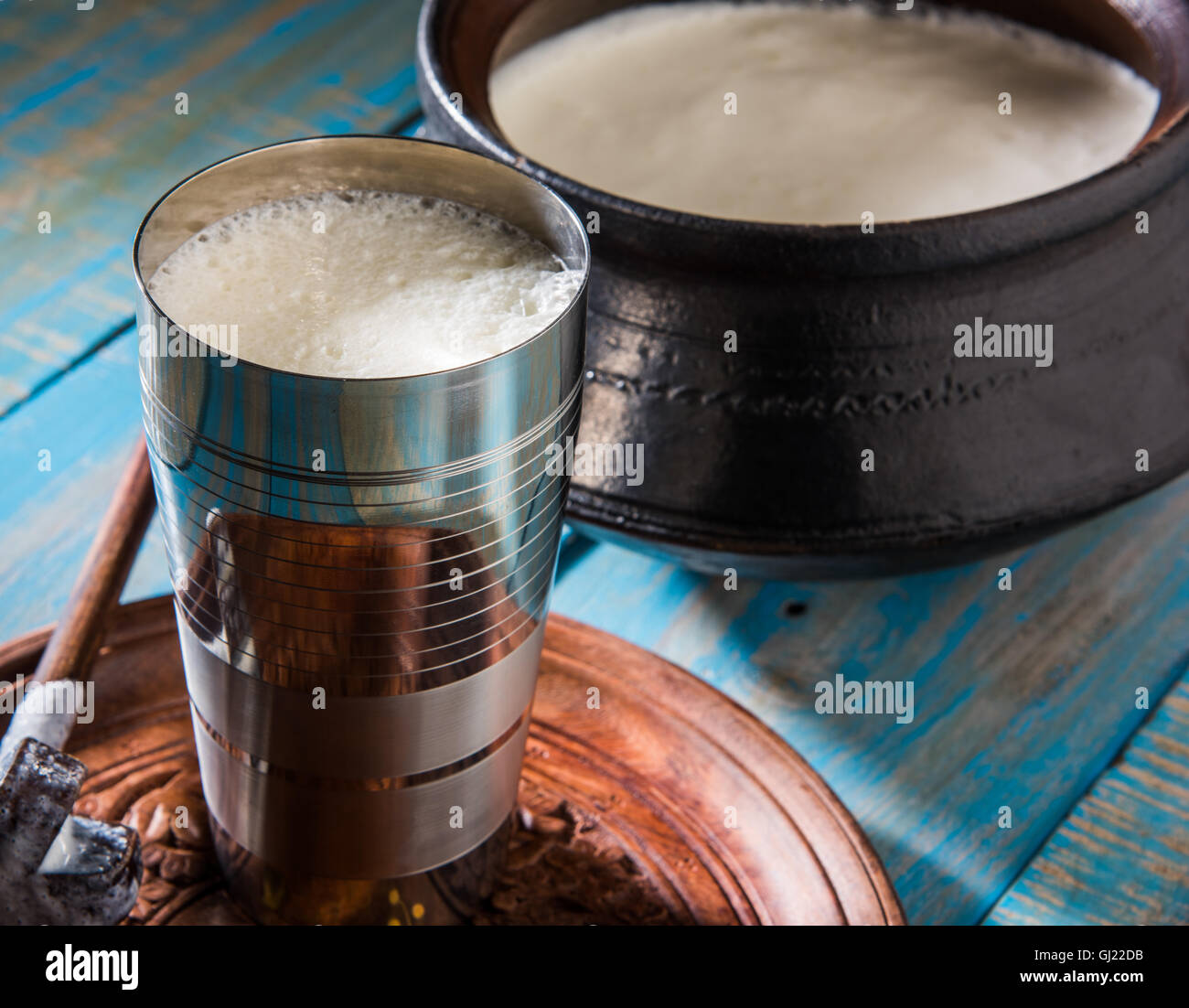 Indian sweet Lassi made up of milk, curd, sugar and salt mixed with ice ...