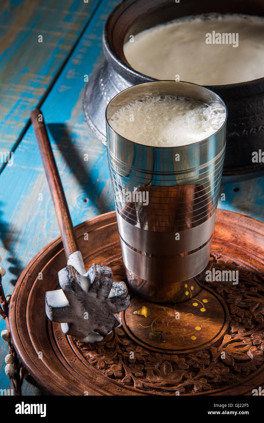 Indian sweet Lassi made up of milk, curd, sugar and salt mixed with ice ...