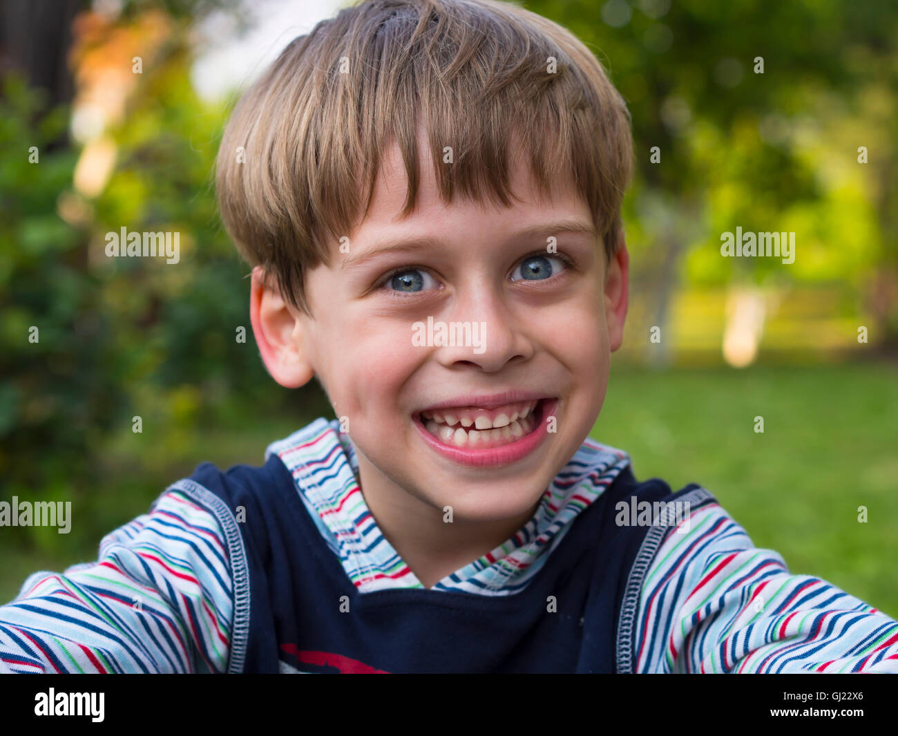 portrait of a cute boy in the nature Stock Photo - Alamy