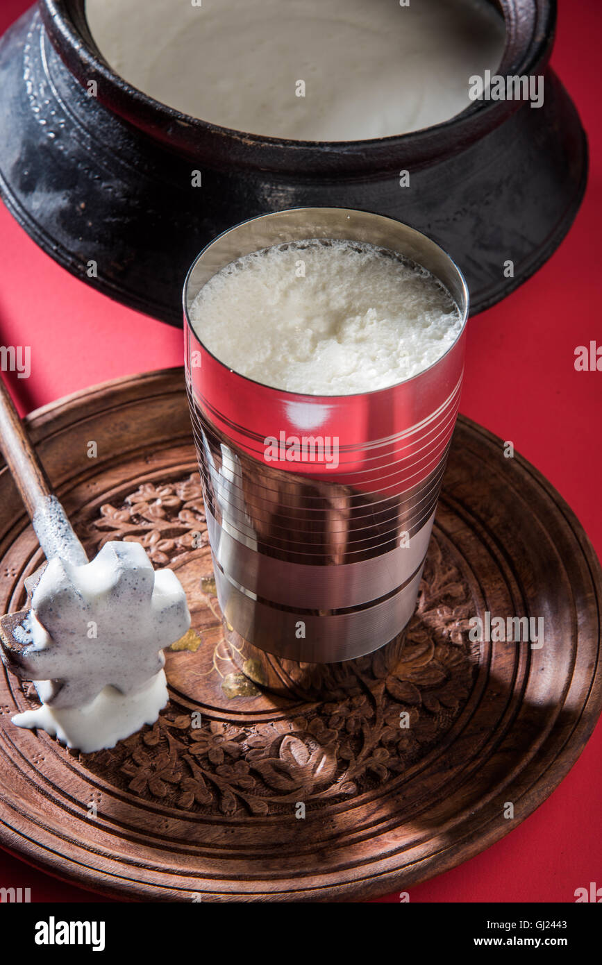 Indian sweet Lassi made up of milk, curd, sugar and salt mixed with ice ...