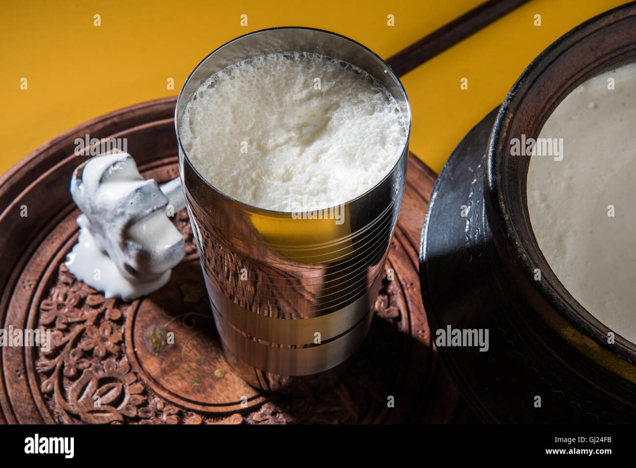 Indian sweet Lassi made up of milk, curd, sugar and salt mixed with ice ...