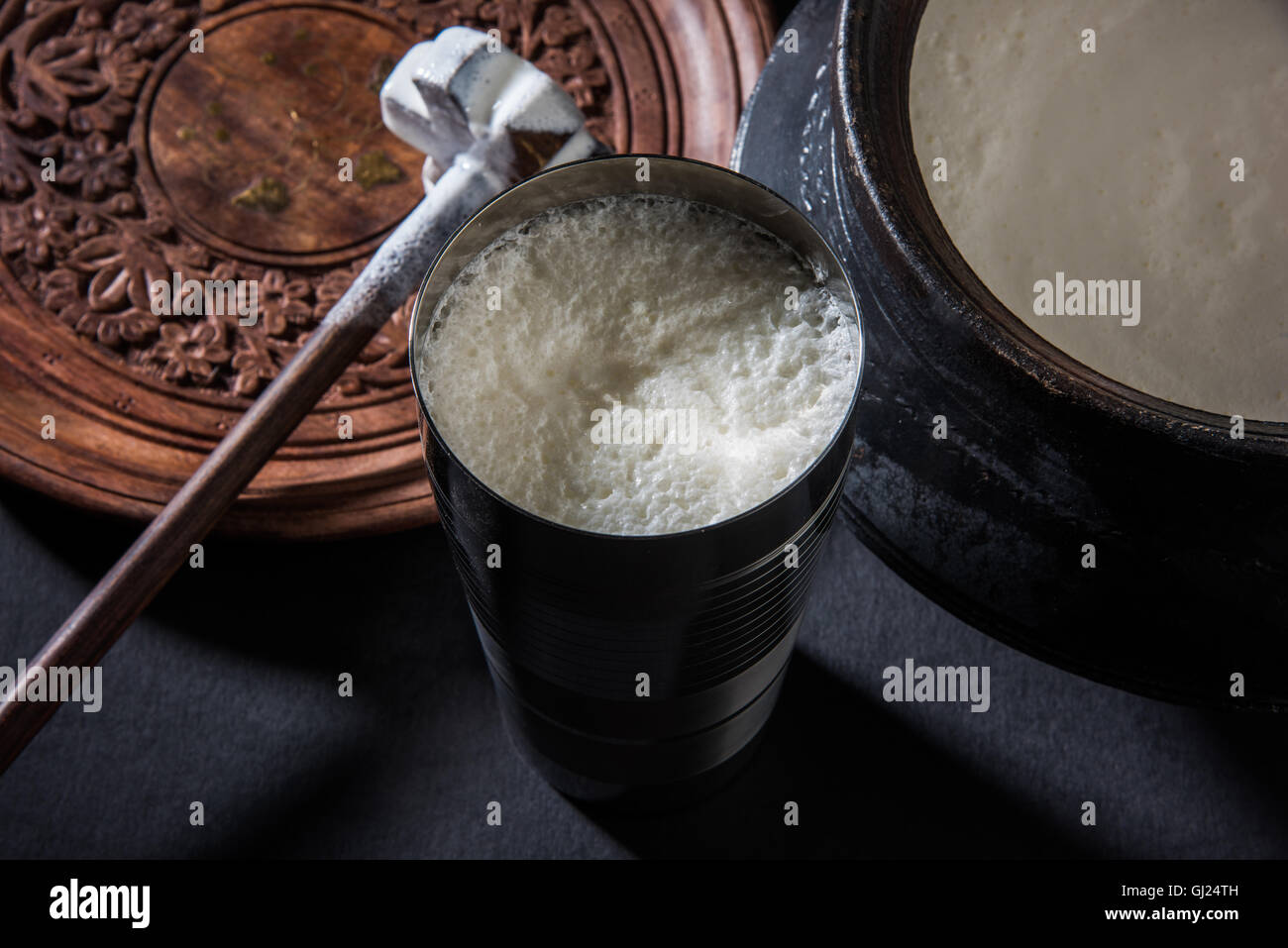 Indian sweet Lassi made up of milk, curd, sugar and salt mixed with ice ...
