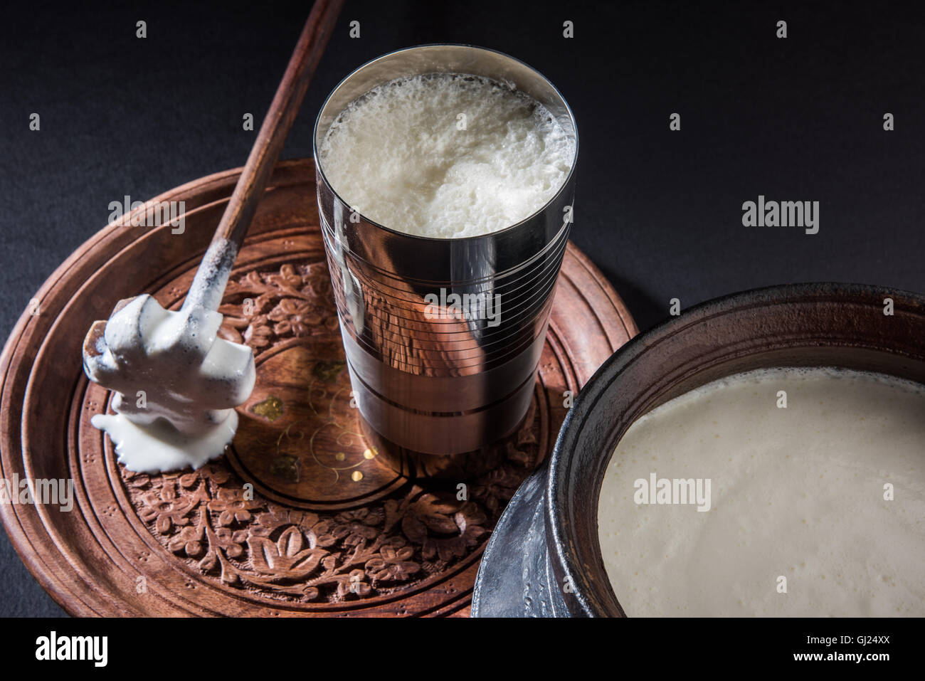 Indian sweet Lassi made up of milk, curd, sugar and salt mixed with ice ...