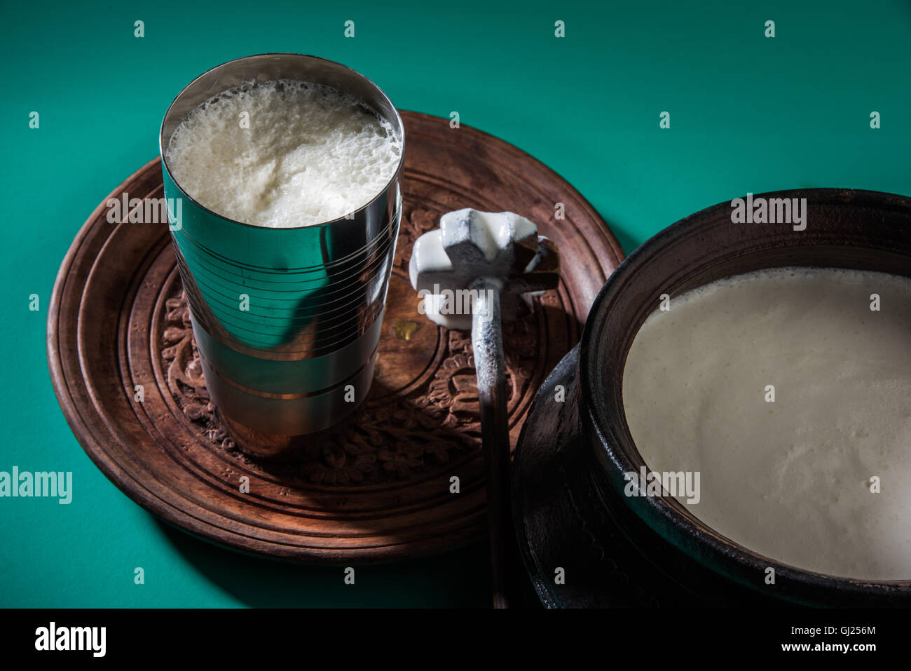 Indian sweet Lassi made up of milk, curd, sugar and salt mixed with ice ...