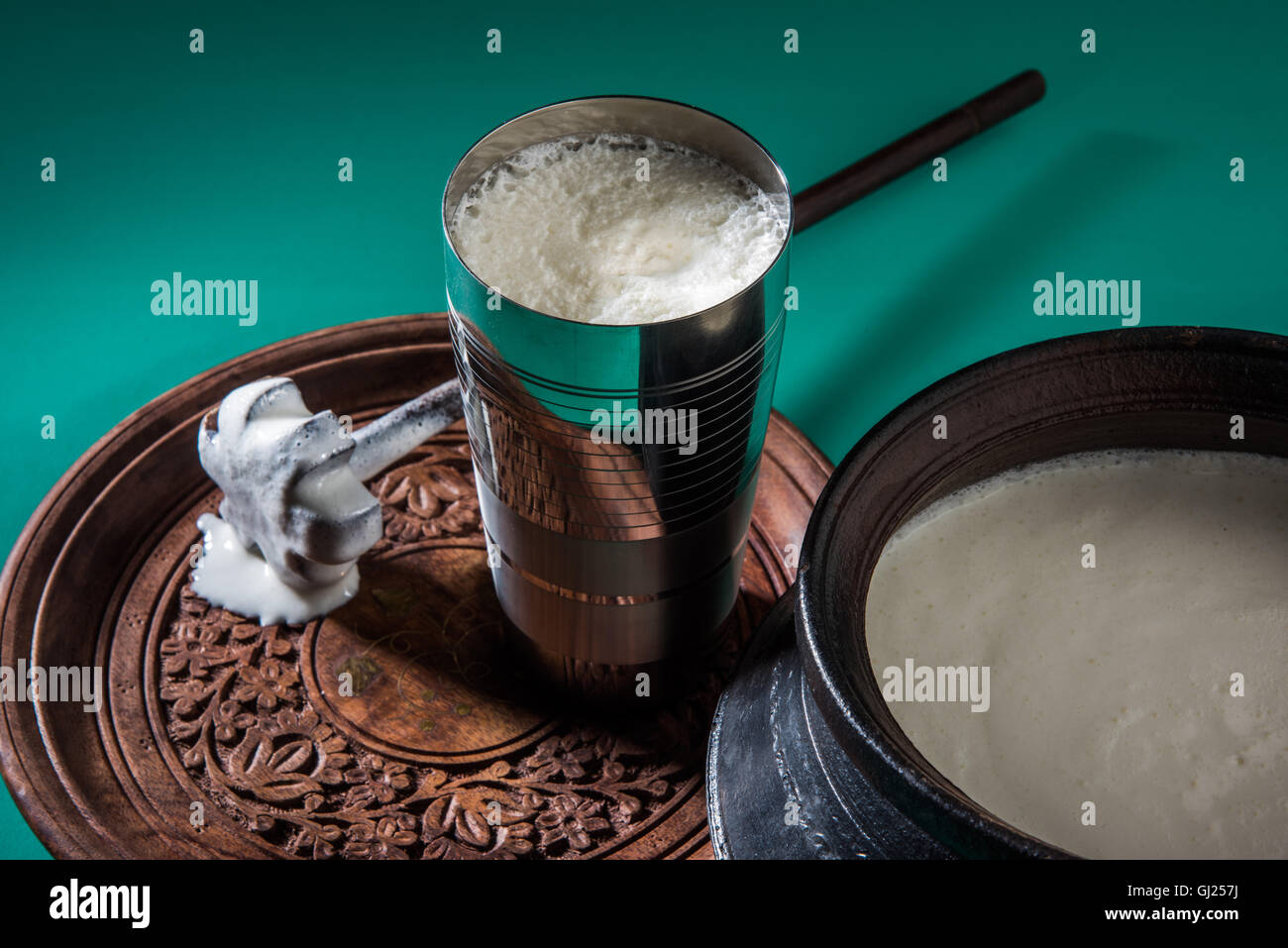 Indian sweet Lassi made up of milk, curd, sugar and salt mixed with ice ...