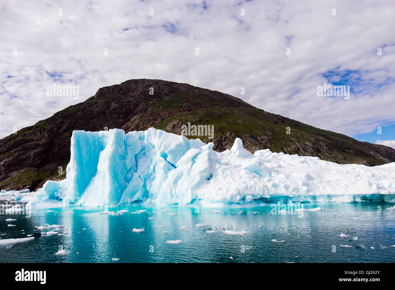 Carving ice from iceberg from Qorqup Sermia glacier grounded on ...